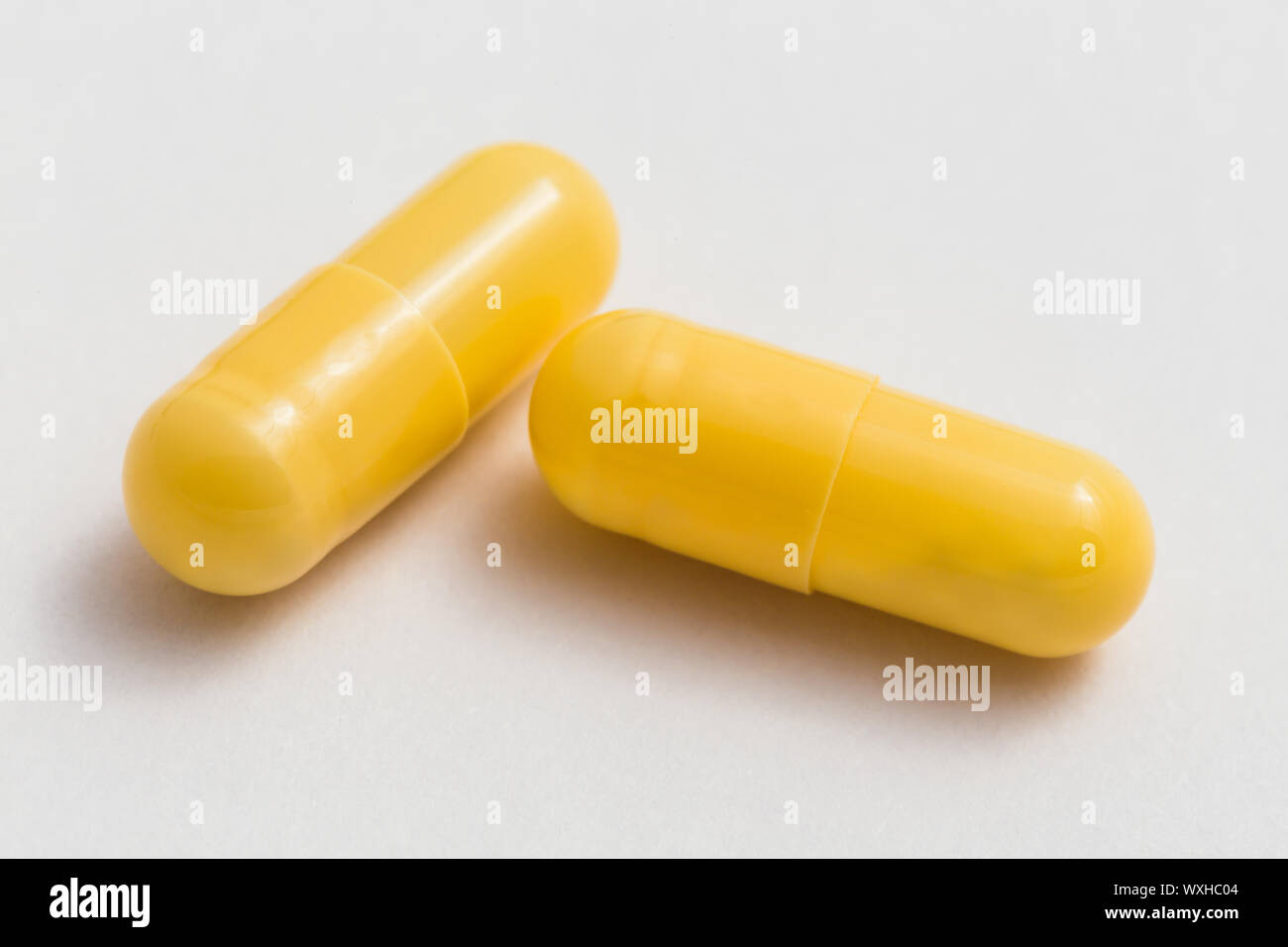 the color pill or just salmon oil capsules Stock Photo - Alamy