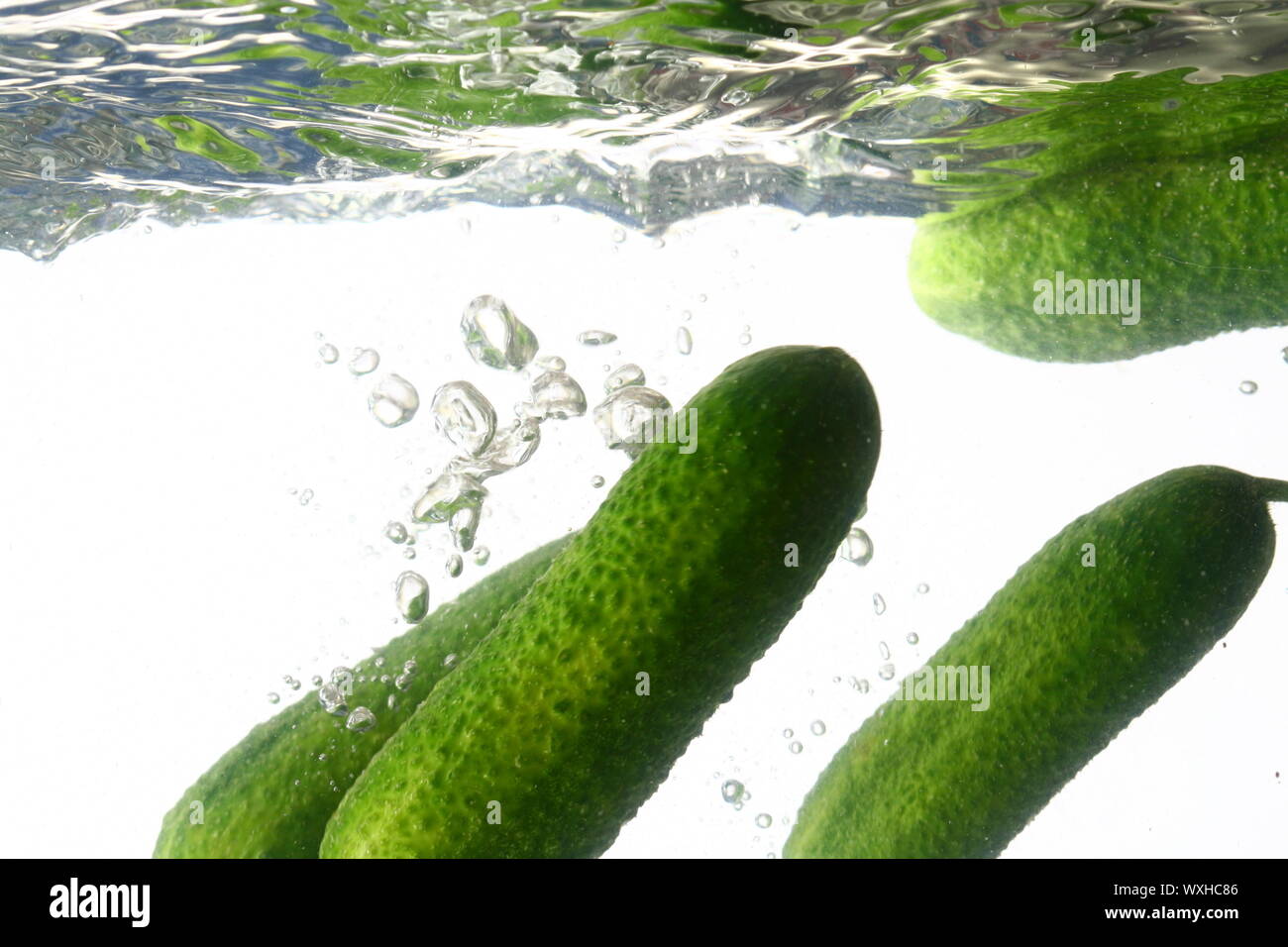 cucumber splash isolated on white background Stock Photo - Alamy