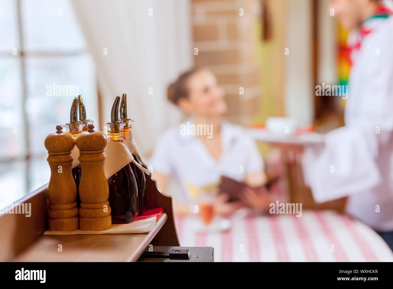 Waiter seasoning pepper hi-res stock photography and images - Alamy