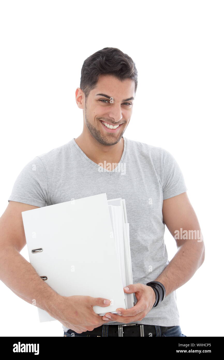 Happy young man holding a pile of folders against the white background ...