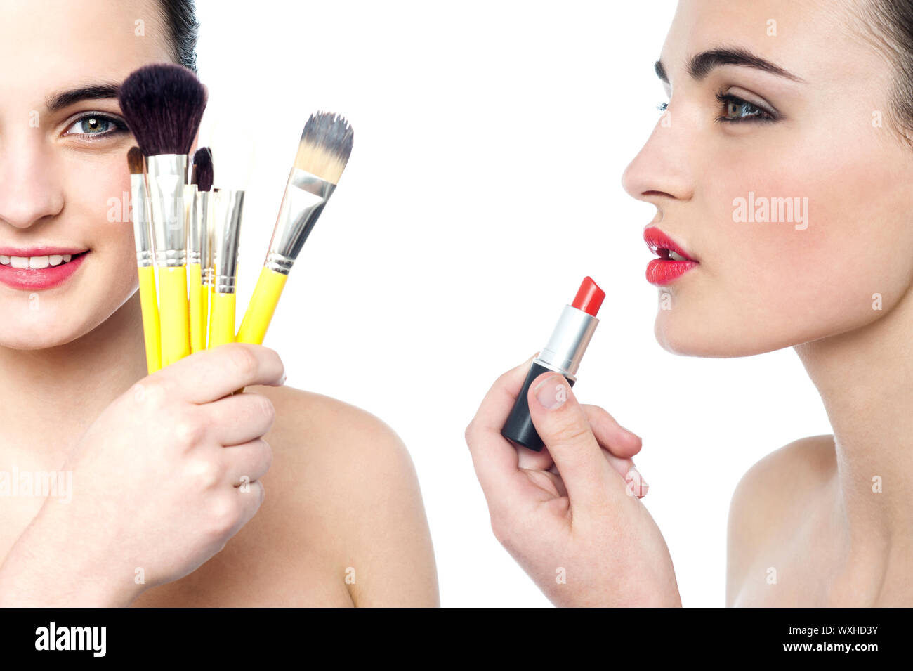Two gorgeous teen girls applying make-up Stock Photo - Alamy