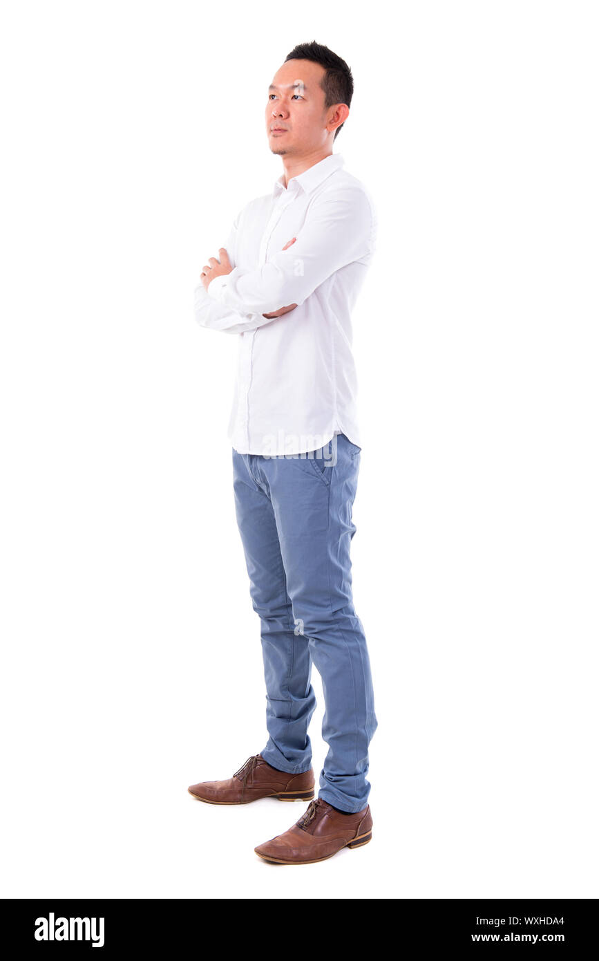 Front view full body confident serious Asian man looking at side ...