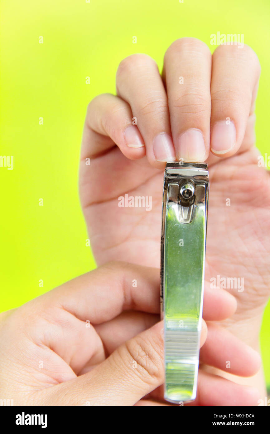 Cutting your fingernails concept Stock Photo - Alamy