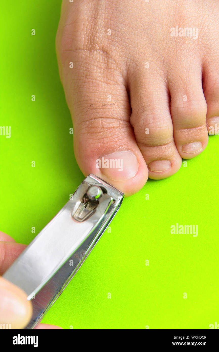 Cutting your toenails Stock Photo - Alamy