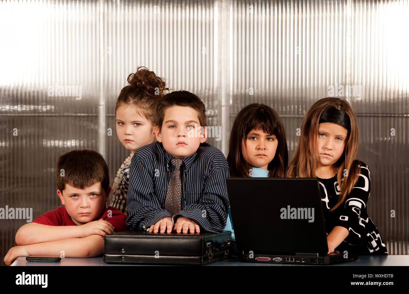 Group of kids as a business team hi-res stock photography and images ...