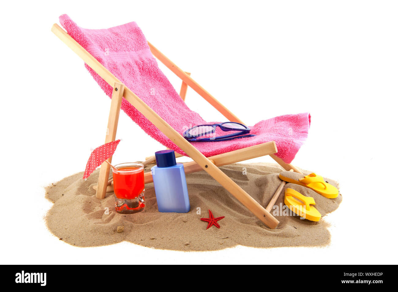 Beach chair in the sand isolated over white Stock Photo - Alamy