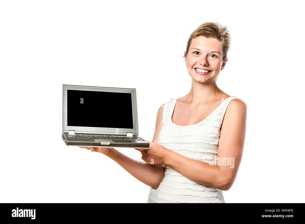 Young, beautiful woman with computer, isolated on white background ...