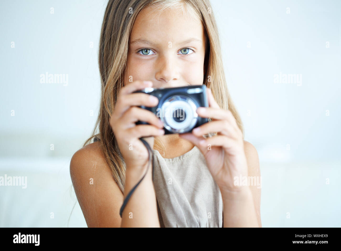 Little girl with compact photo camera Stock Photo - Alamy
