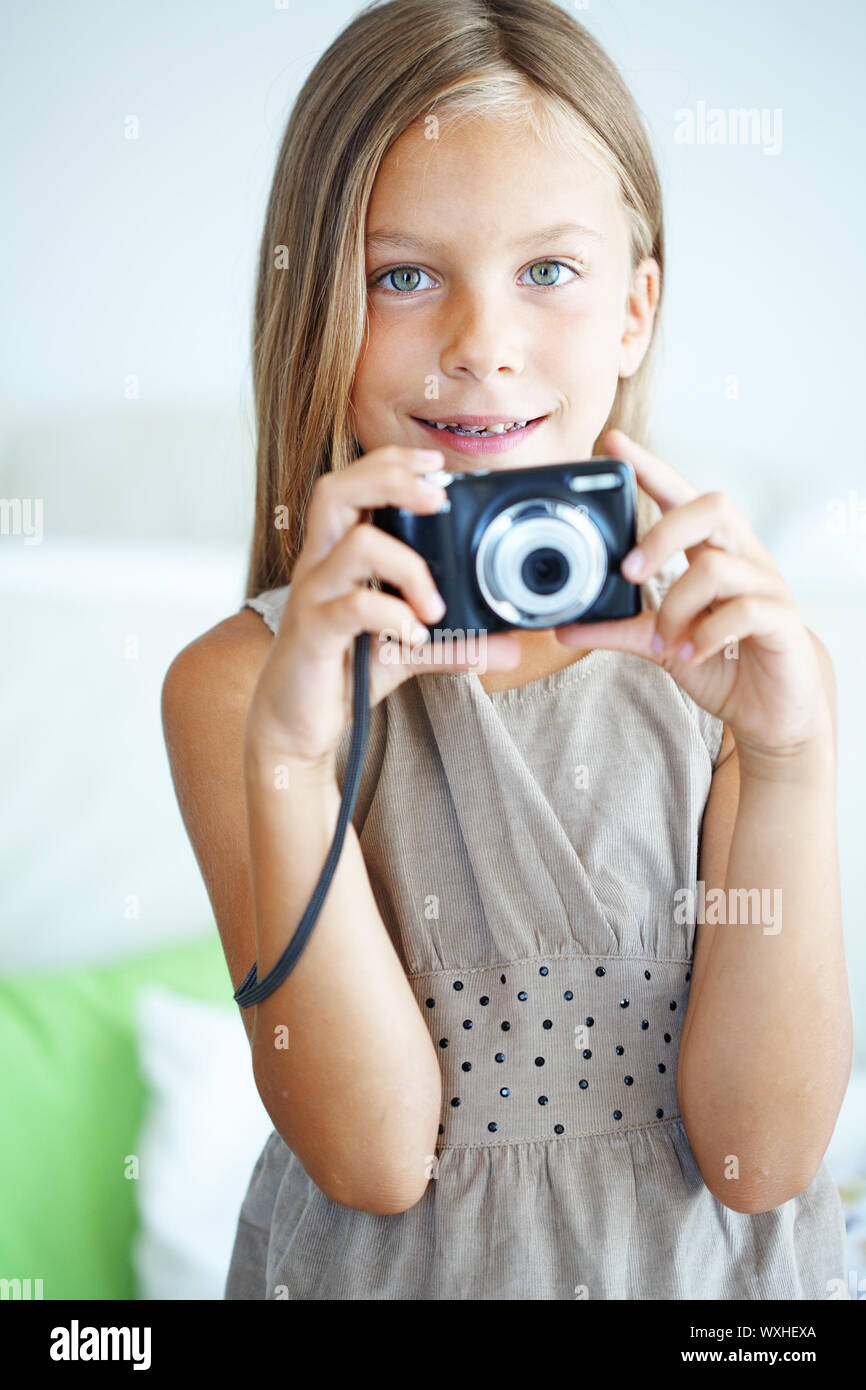 Little girl with compact photo camera Stock Photo - Alamy