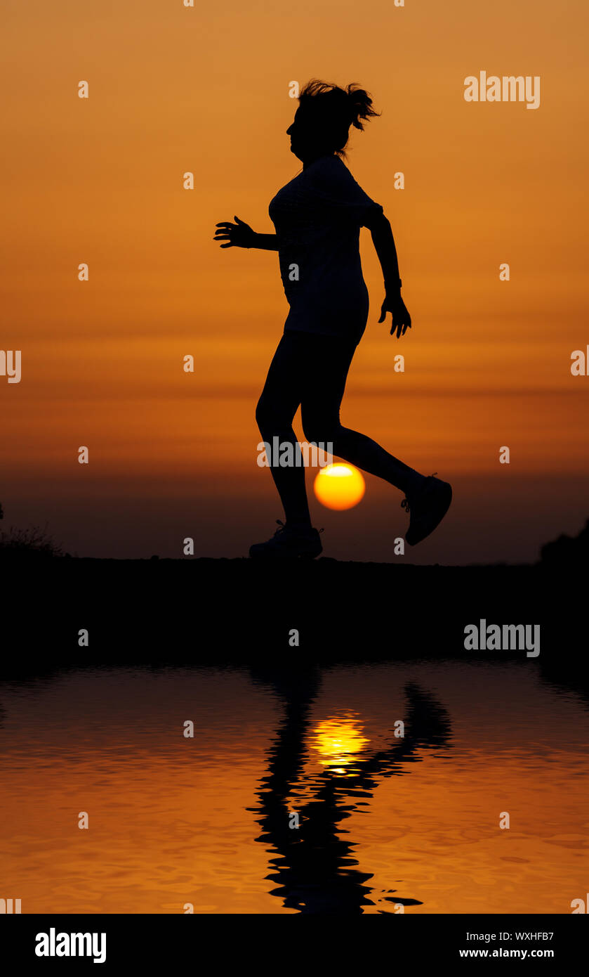 Reflection female runner hi-res stock photography and images - Alamy