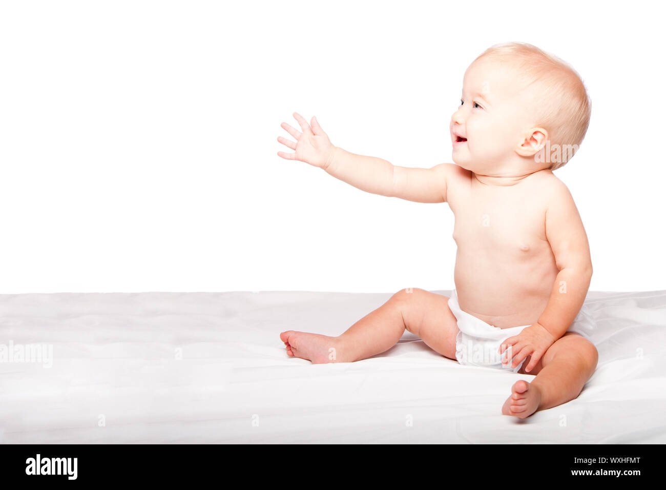 Cute adorable infant baby reaching out with hand asking for something ...