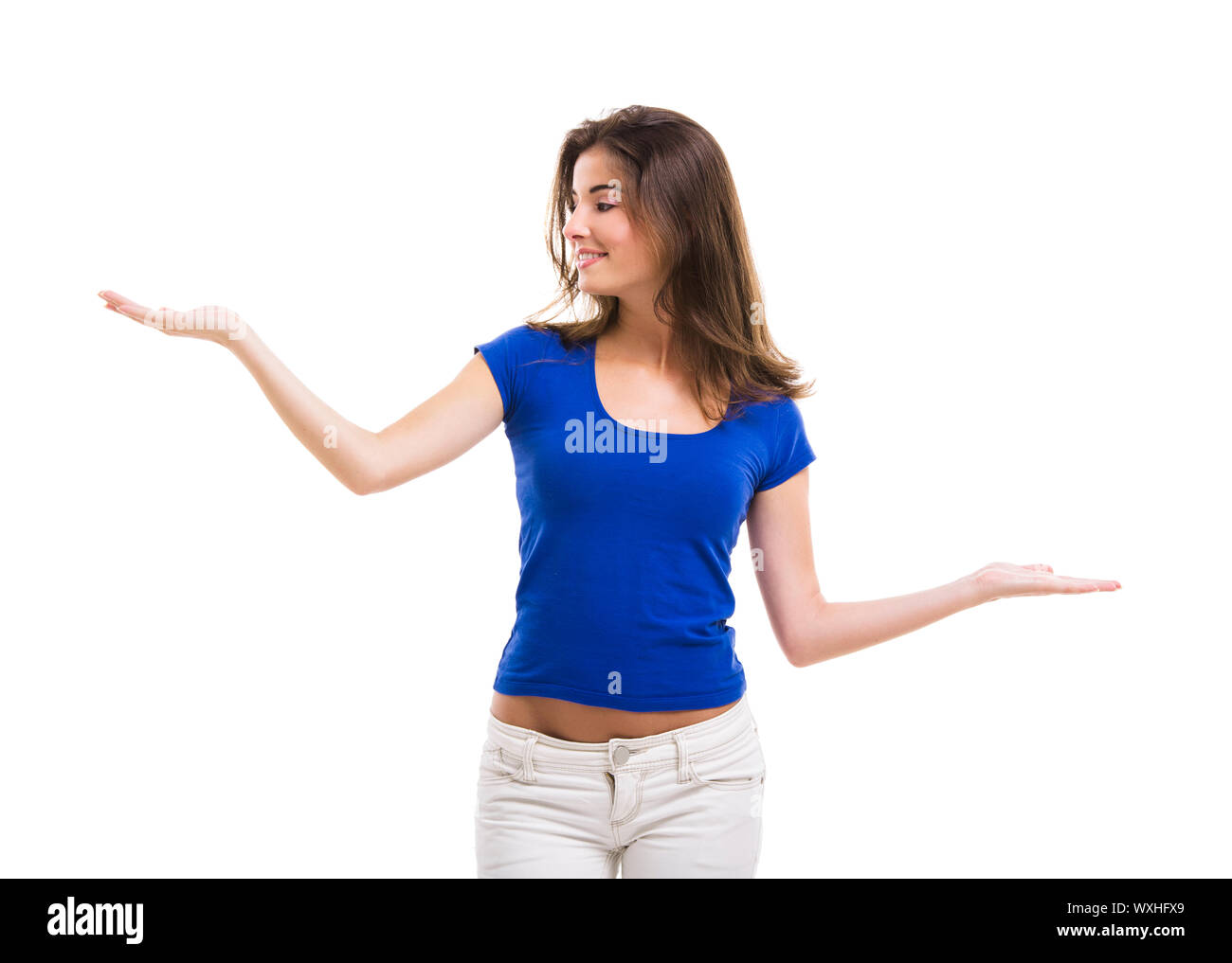 Beautiful young woman with arms open making a scale, isolated over a ...