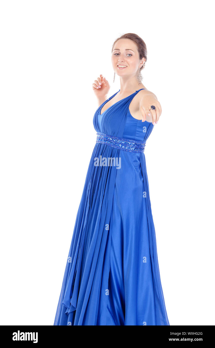 Portrait of a beautiful young woman in blue dress, holds out his hand ...