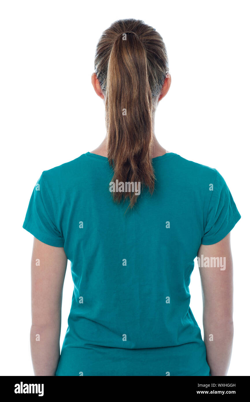 Young woman facing towards the wall Stock Photo - Alamy