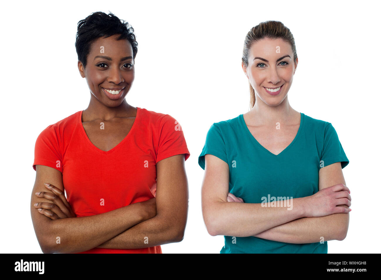 Two charming ladies posing with confidence Stock Photo - Alamy