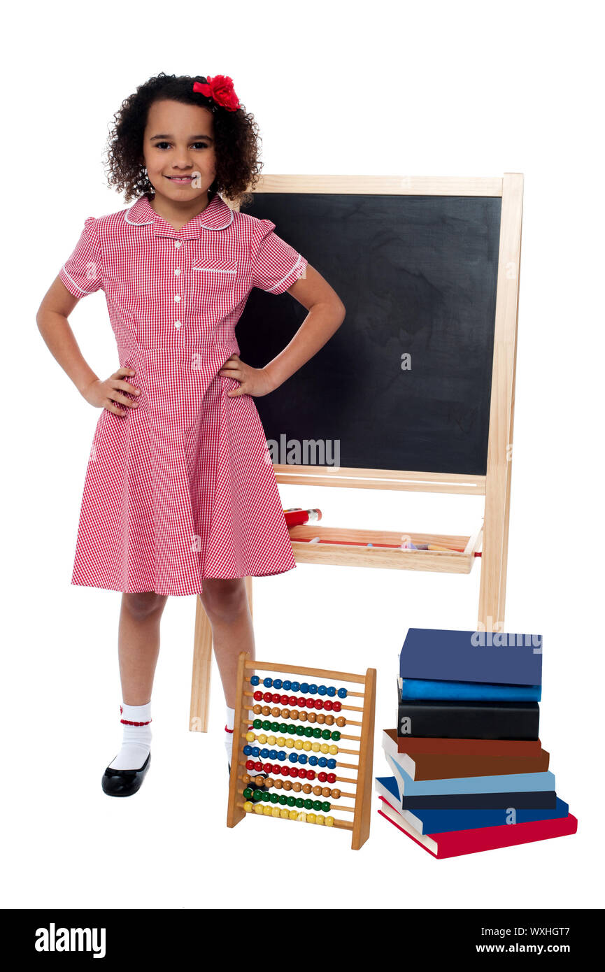 Pretty school child posing confidently Stock Photo - Alamy