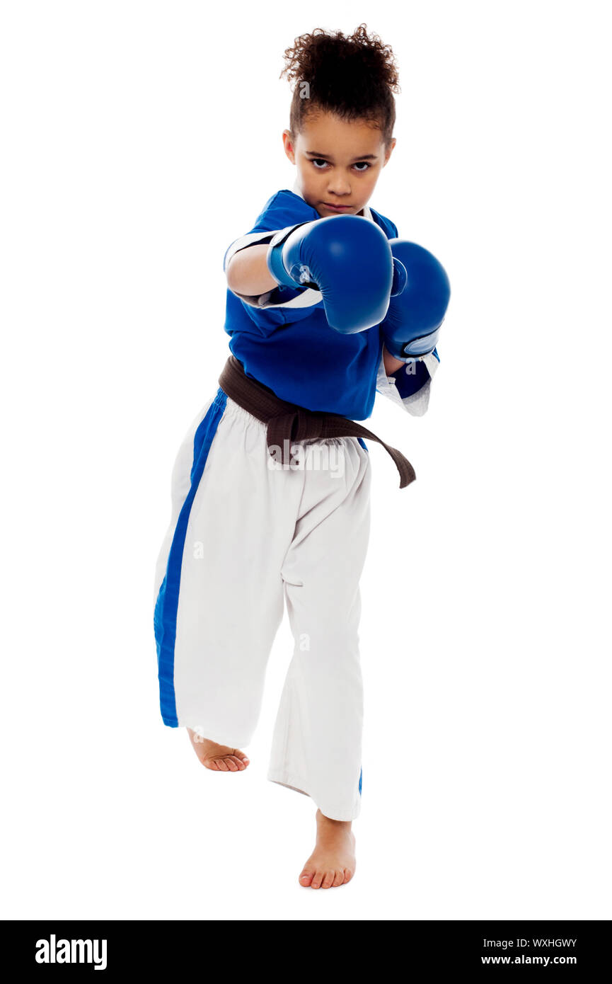 Little karate girl throwing right arm punch Stock Photo - Alamy