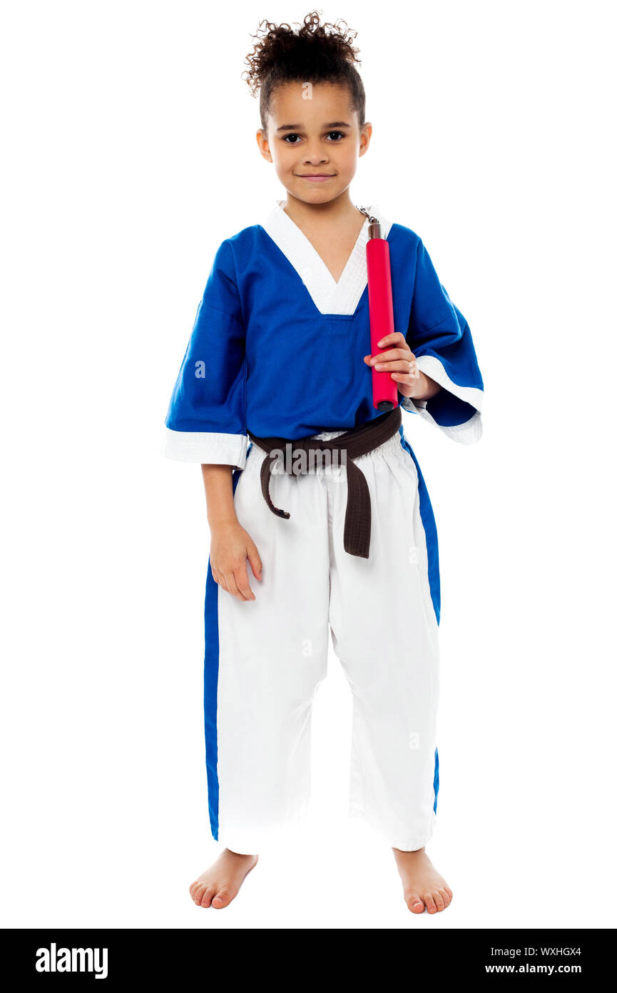 Smiling young karate girl with nunchucks Stock Photo - Alamy
