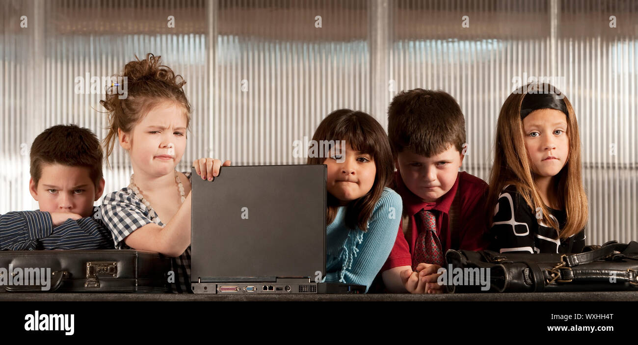 Kids posing as a professional business team Stock Photo - Alamy