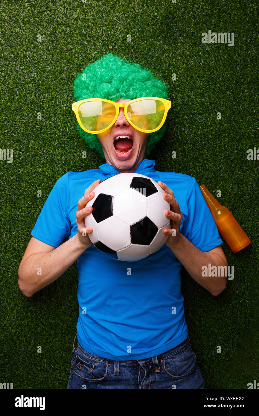 Football fan support his team and celebrate a goal on grass Stock Photo ...