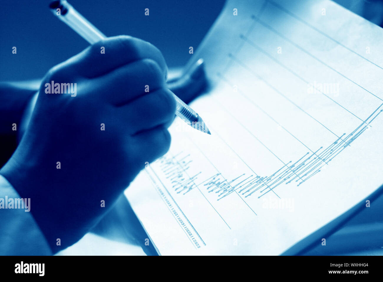 read the graph in financial report Stock Photo - Alamy