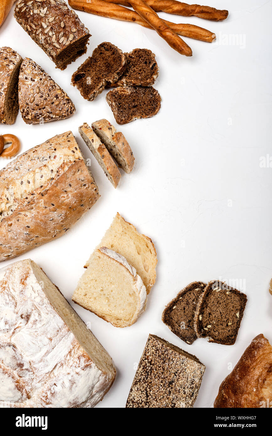 Different types of bread on a white background. Top view. Copy space ...