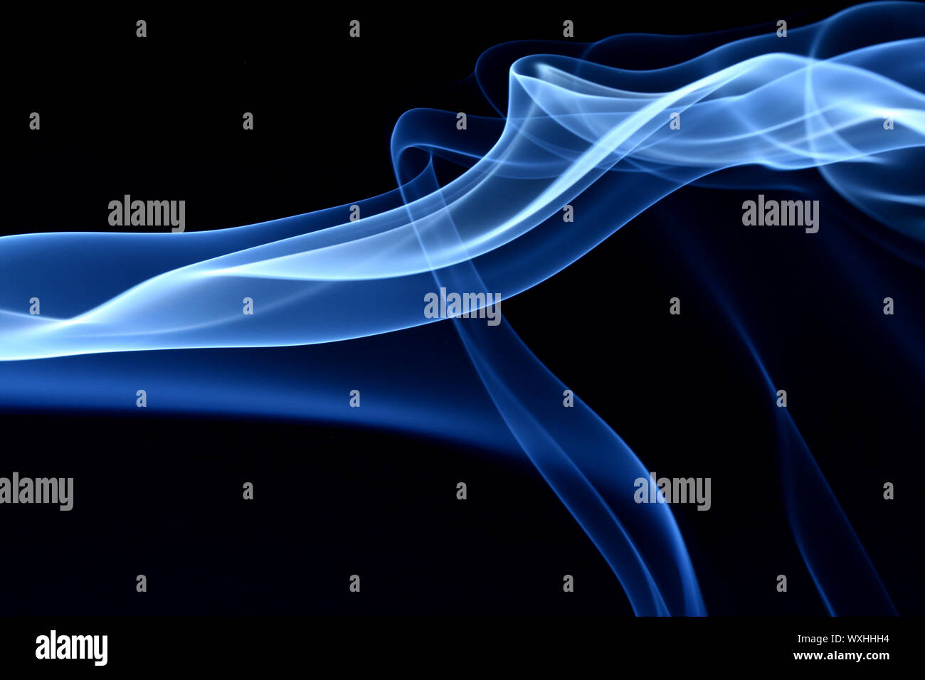 blue smoke on black background Stock Photo - Alamy