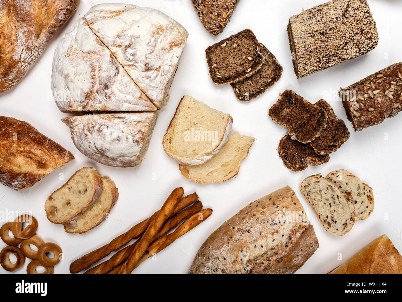 Different types of bread on a white background. Top view Stock Photo ...