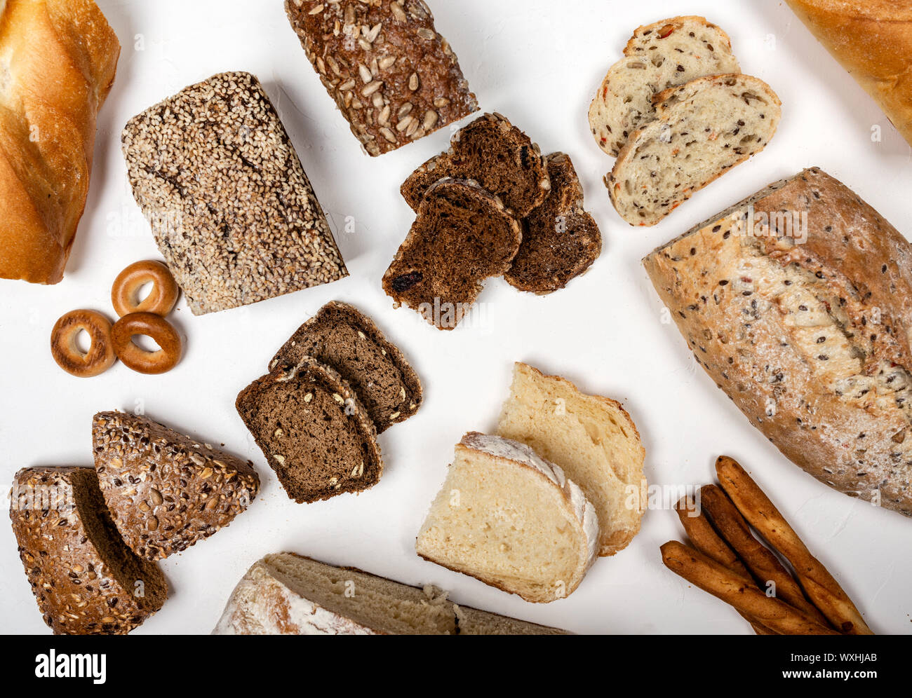 Different types of bread on a white background. Top view Stock Photo ...