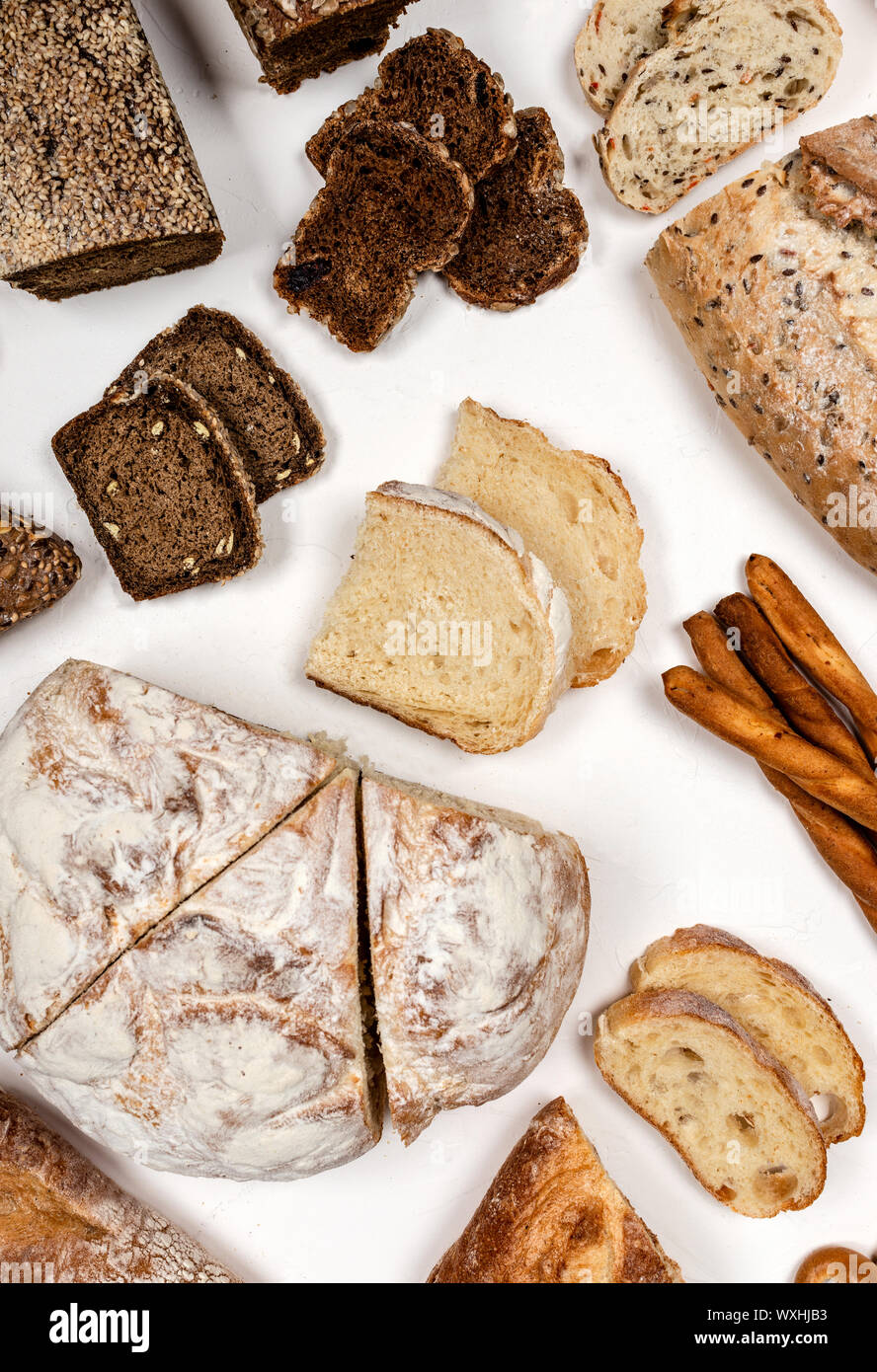 Different types of bread on a white background. Top view Stock Photo ...