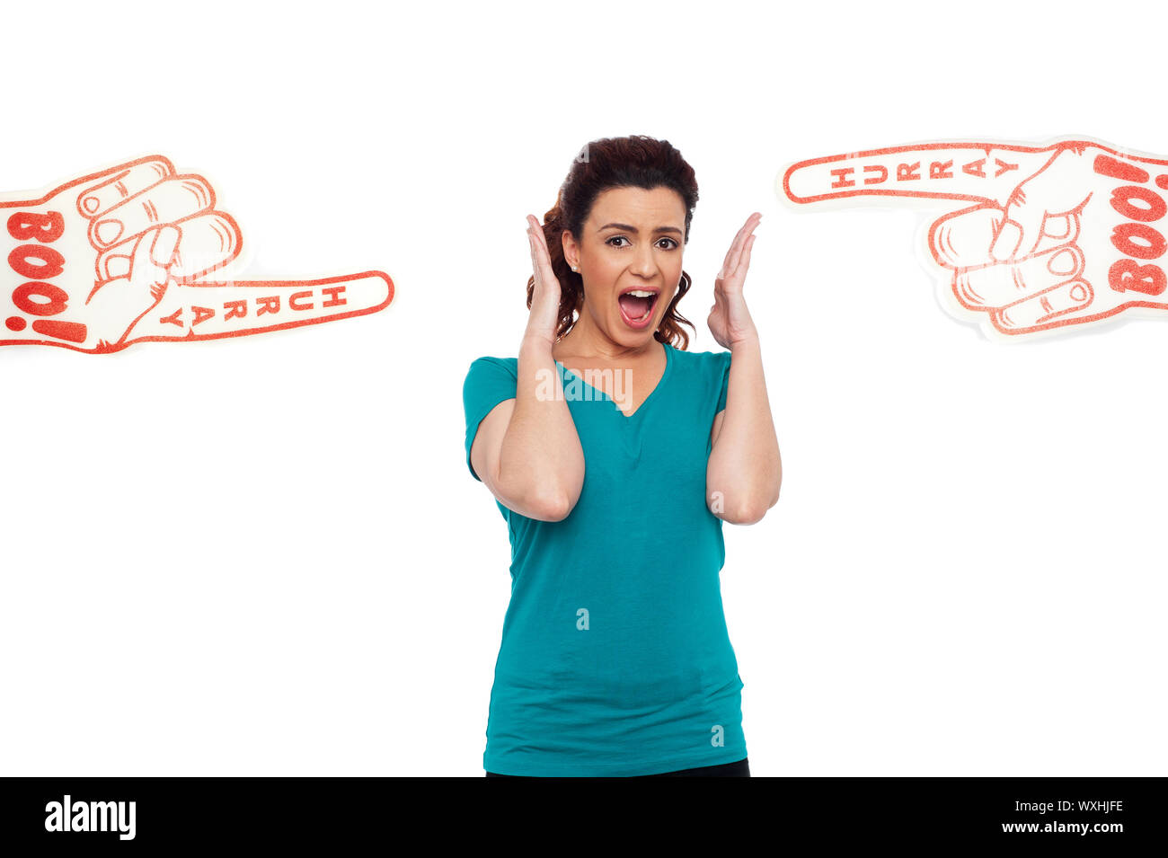 Woman shouting loud, stuck in between two large hurray boo foam hands ...
