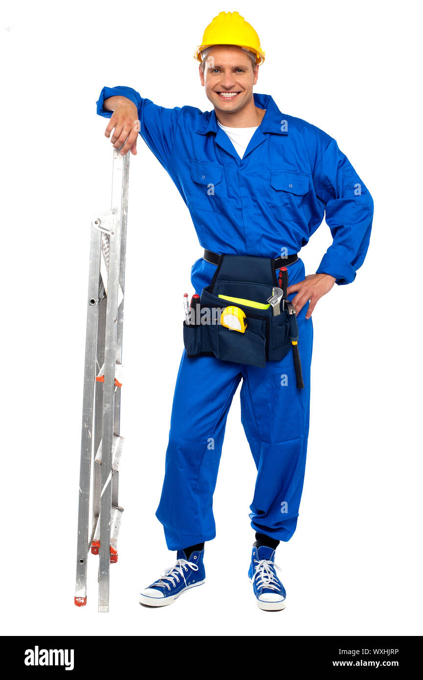Full length portrait of smiling Industrial contractor resting hand on ...