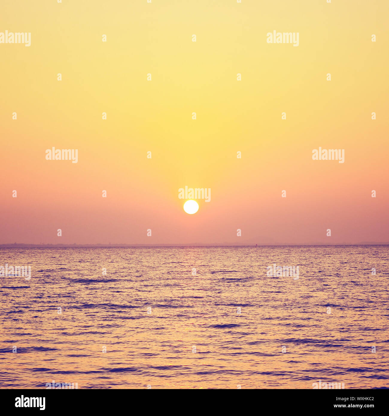 Sunrise over the sea with retro filter effect Stock Photo - Alamy