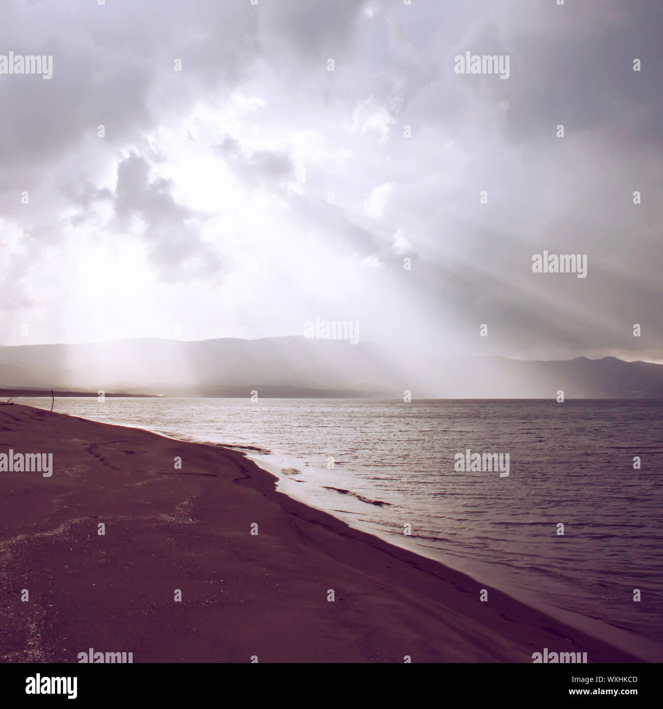 Sunbeam through the sea with retro filter effect Stock Photo - Alamy