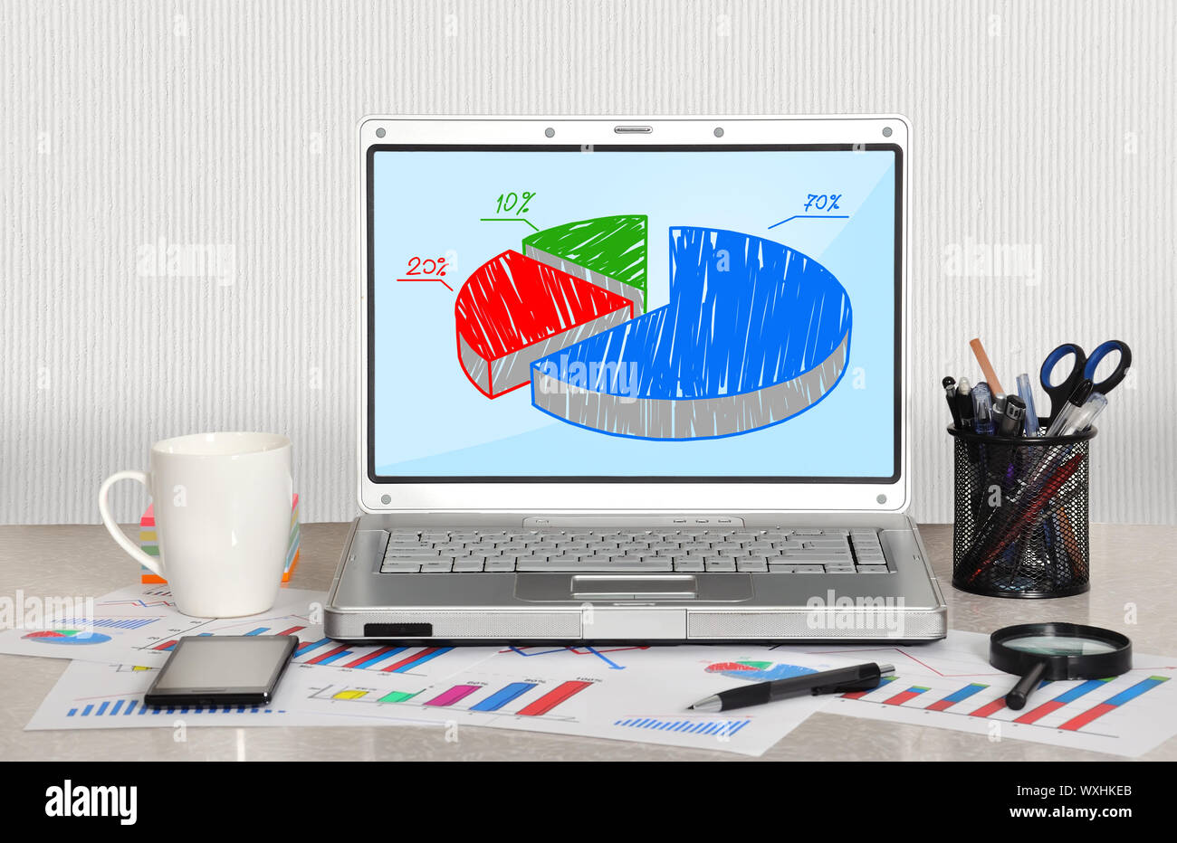pie chart om screen laptop in office Stock Photo - Alamy