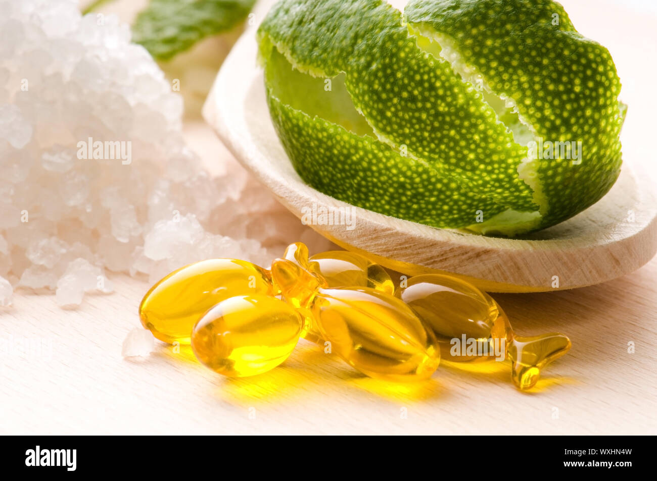 lemon bath - bath salt, capsule and fresh fruits Stock Photo - Alamy