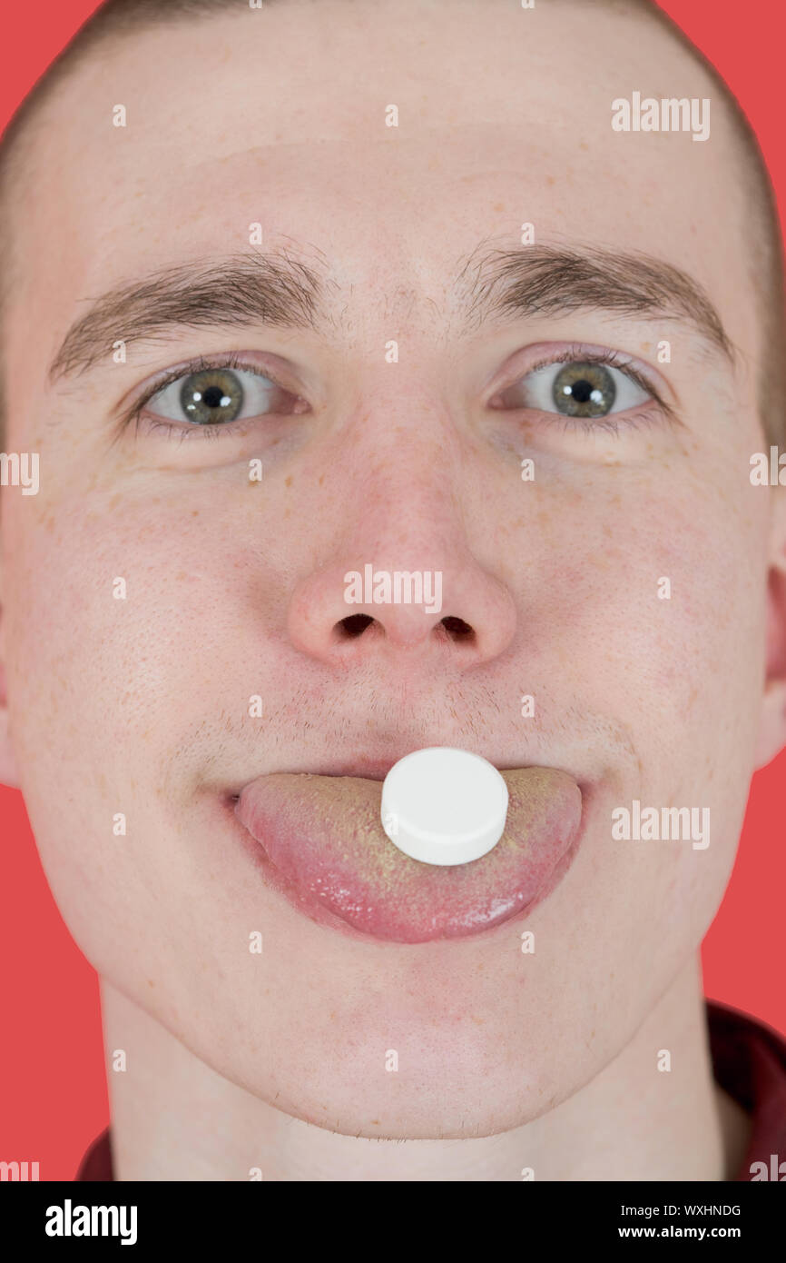 Drug addict on the red background isolated Stock Photo - Alamy