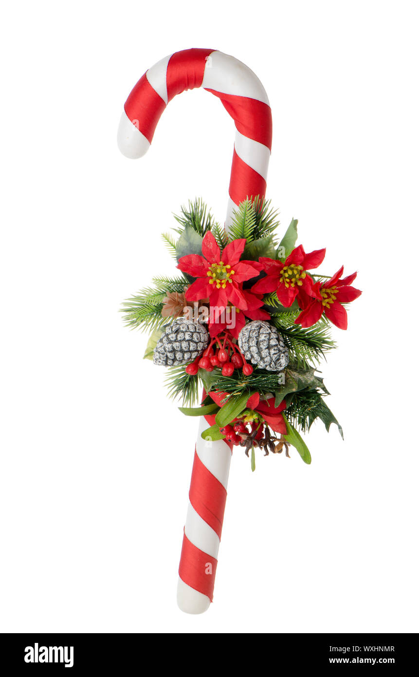 Christmas cane with floral arrangement isolated on white background ...