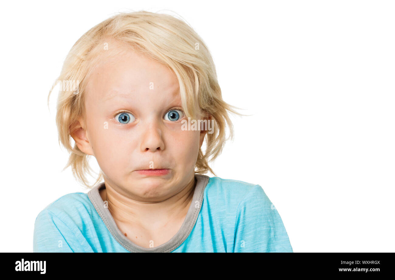 A cute funny boy pulling funny scared face. Isolated on white Stock ...