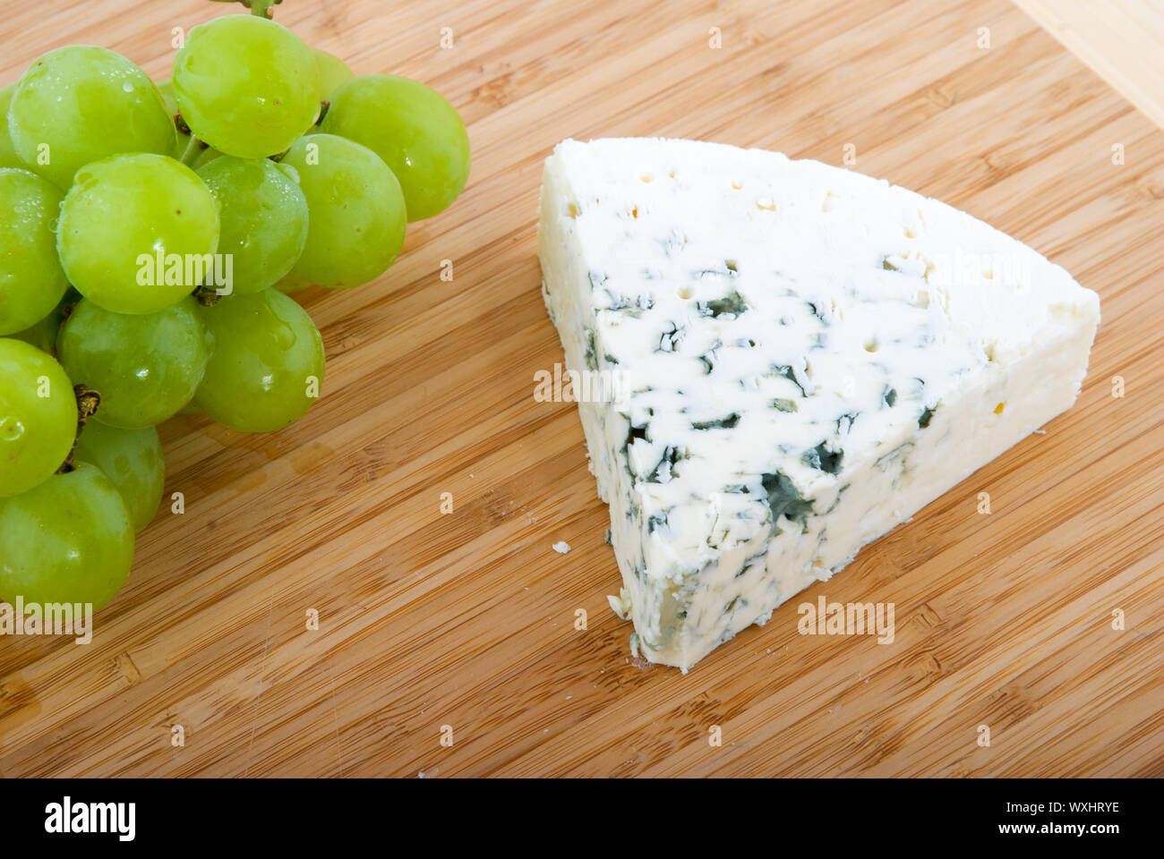 Danish blue cheese with green grapes Stock Photo - Alamy