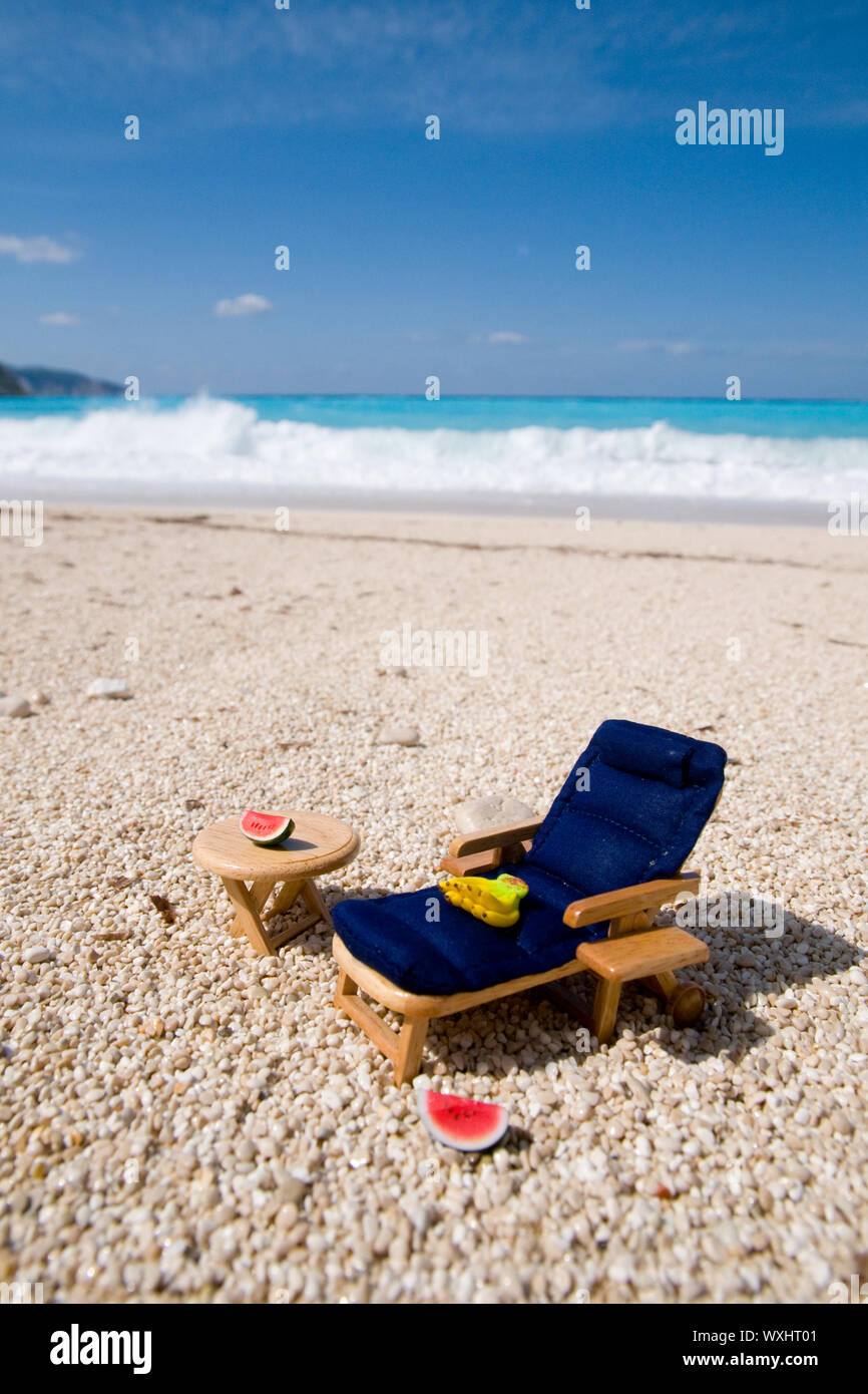 Miniature furniture for sun tanning at the beach Stock Photo - Alamy
