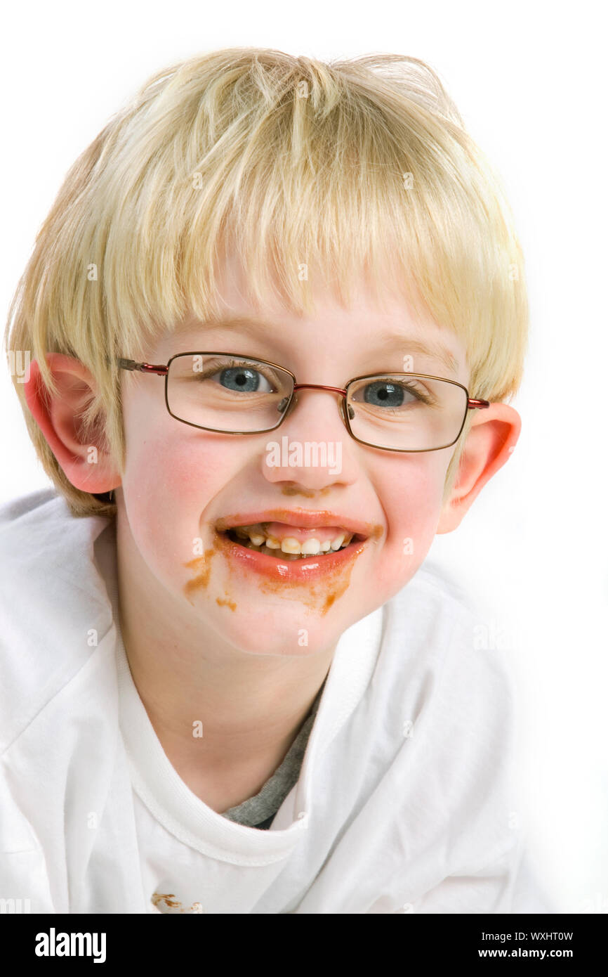 Boy is making a mess with chocolate Stock Photo - Alamy