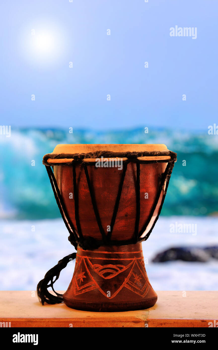 Photo of small brown tambour with the sea on the background Stock Photo ...