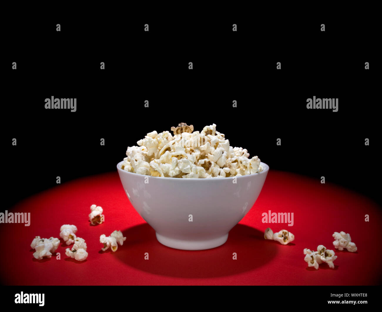 A bowl full of popcorn under the spotlight Stock Photo - Alamy