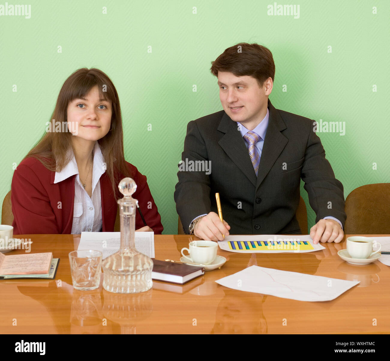 Business team sits at the big table Stock Photo - Alamy