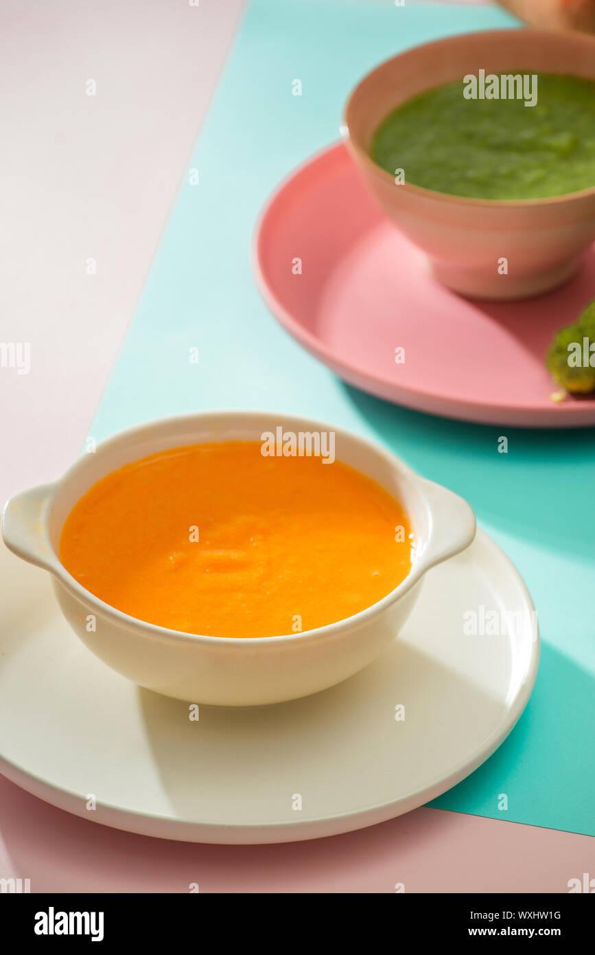 Bowls with baby food. Various bowls of fruit and vegetable puree with ...