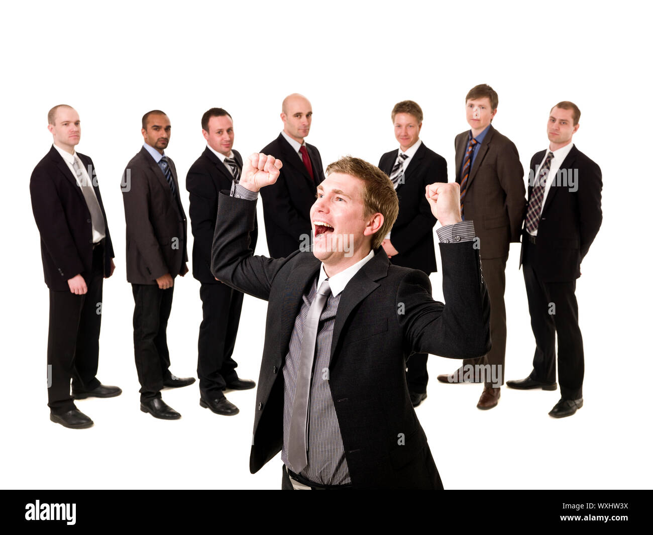 Happy man in front of his team isolated on white background Stock Photo ...