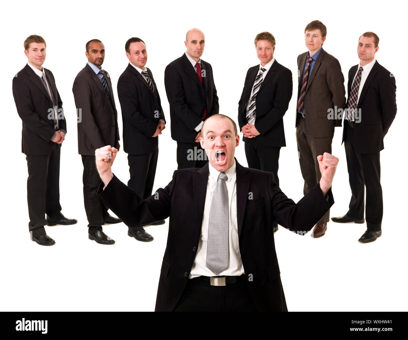 Happy man in front of his team isolated on white background Stock Photo ...