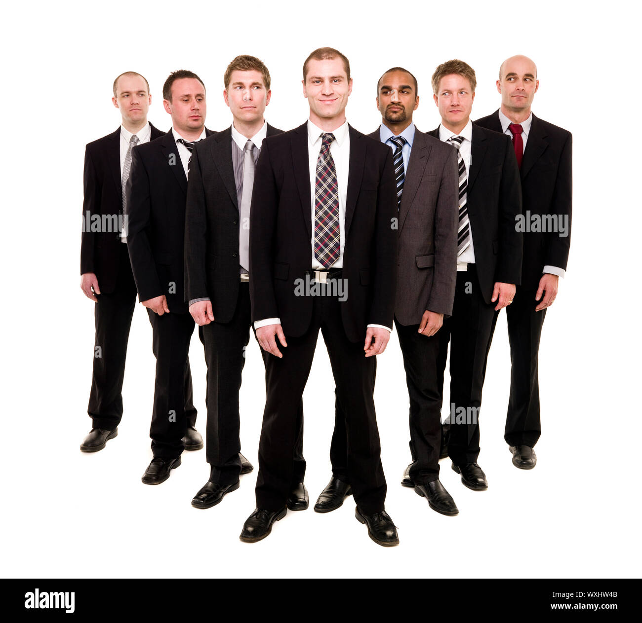 Smiling manager in front of his team isolated on white background Stock ...