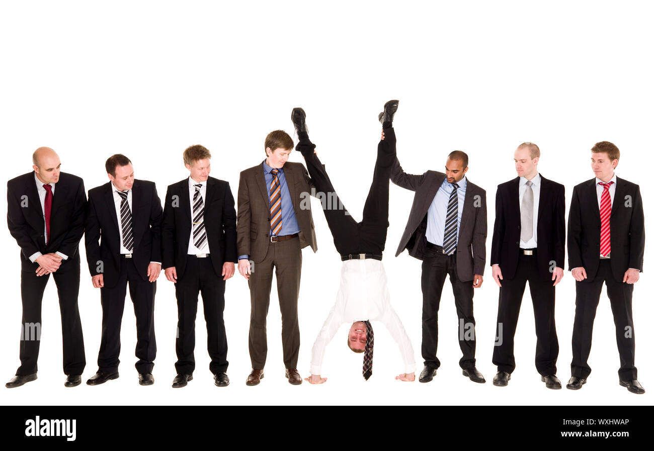 Group of businessmen with the boss upside down Stock Photo - Alamy